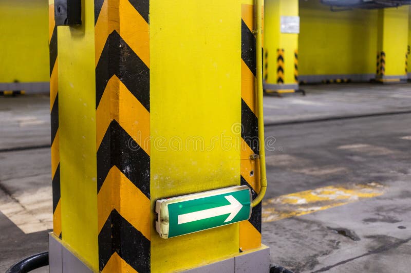 Green Traffic Direction Arrow Sign on Yellow Post Stock Image - Image ...