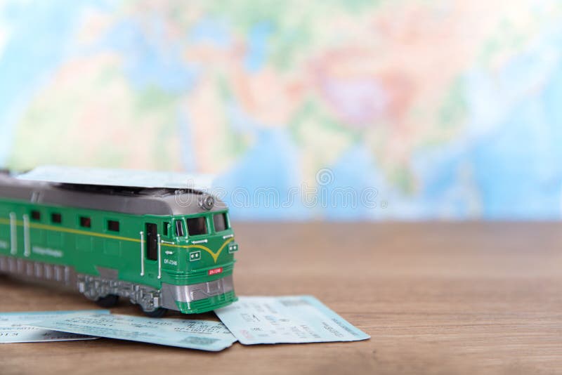 Green Train and Train Tickets in Front of the Map Stock Image - Image ...