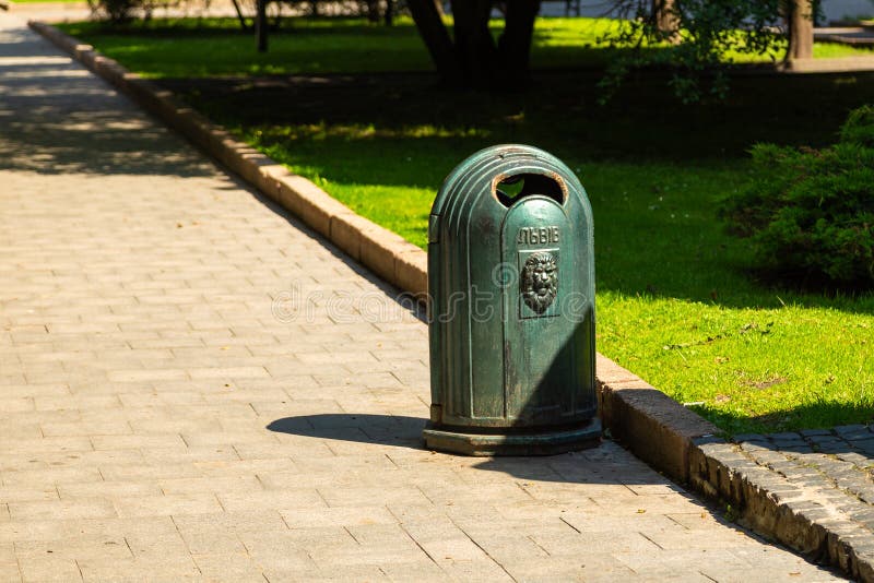 Green Trash Can on the Park Path, Lviv, Ukraine Stock Photo - Image of ...
