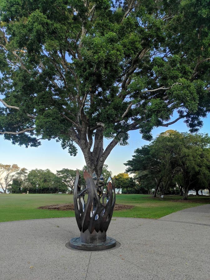 Green Tree Behind Monument in the Park Stock Image - Image of cloudy ...