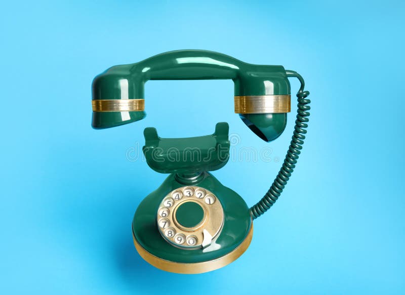Green Vintage Corded Phone on Light Blue Background Stock Photo - Image ...