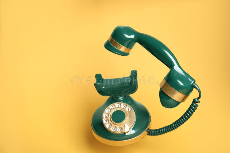 Green Vintage Corded Phone on Yellow Background Stock Photo - Image of ...