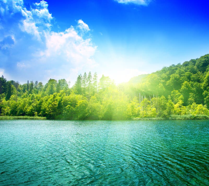 Green Water Lake and Sunset Stock Photo - Image of sunlight, mountain ...