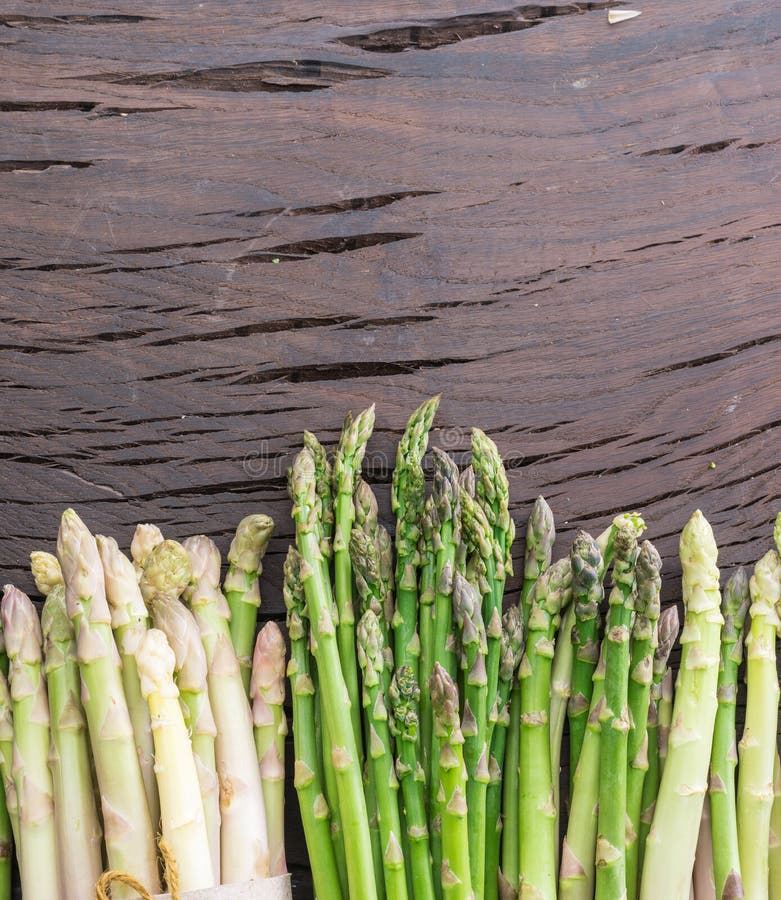 Green and White Types of Asparagus Sprouts on Wooden Table. Top View ...