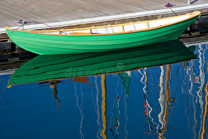Green wooden row boat stock image. Image of water, green - 10990735