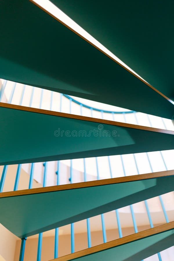 Spiral Staircase, Forged Green Handrail and Wooden Steps in Modern Home ...