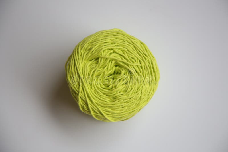 Green Wool Yarn Placed on a White Base, Will Be Used for Knitting ...