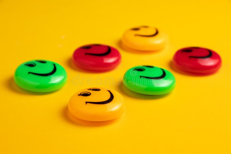 Green Yellow and Red Round Magnet with Smile in a Row on a Yellow ...