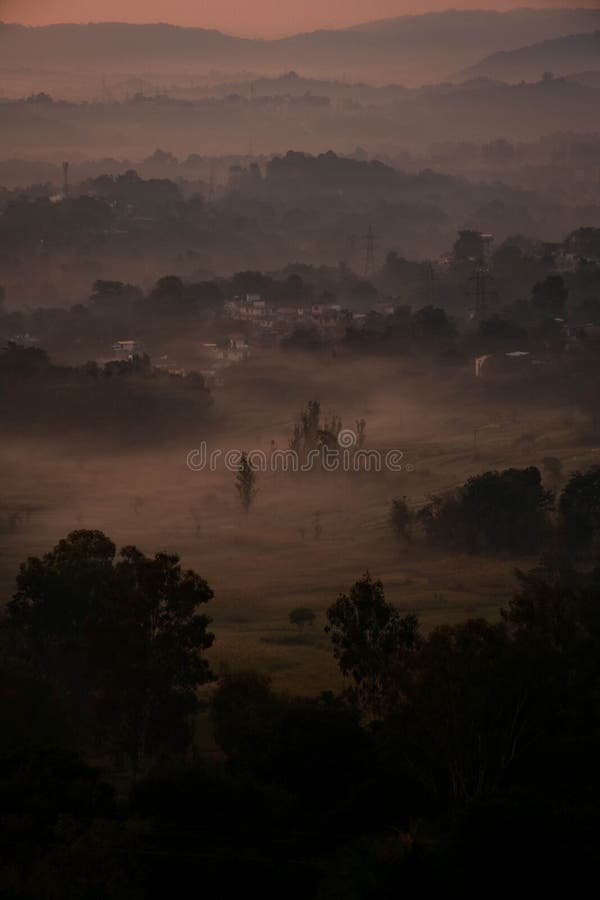Greenery Field at Sunset in a Mist Stock Image - Image of sunset ...