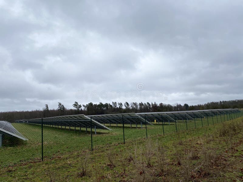 Greenfield with Solar Panels on a Cloudy Day Stock Photo - Image of ...