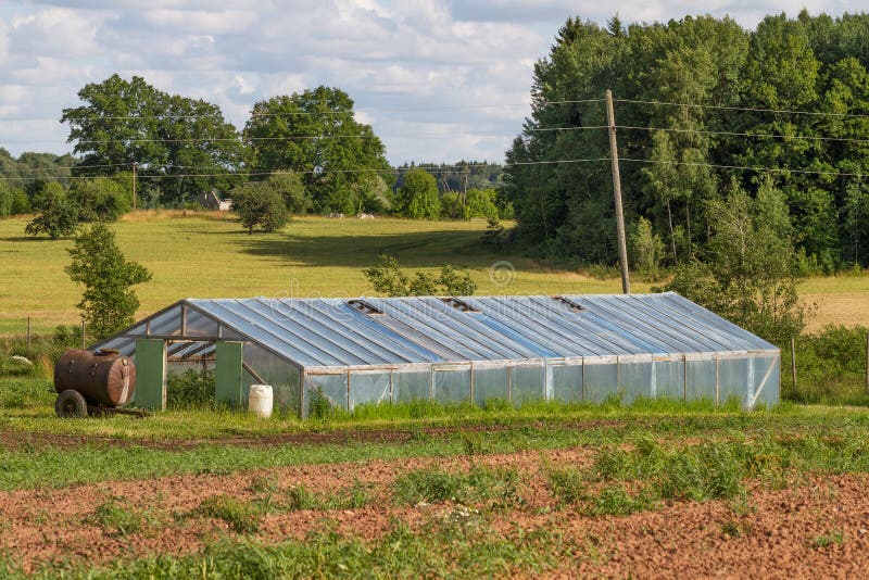 Greenhouse in countryside. stock photo. Image of farm - 58472958