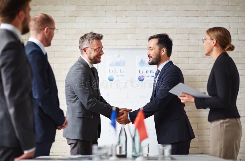 Greeting business partners stock photo. Image of executive - 63818260
