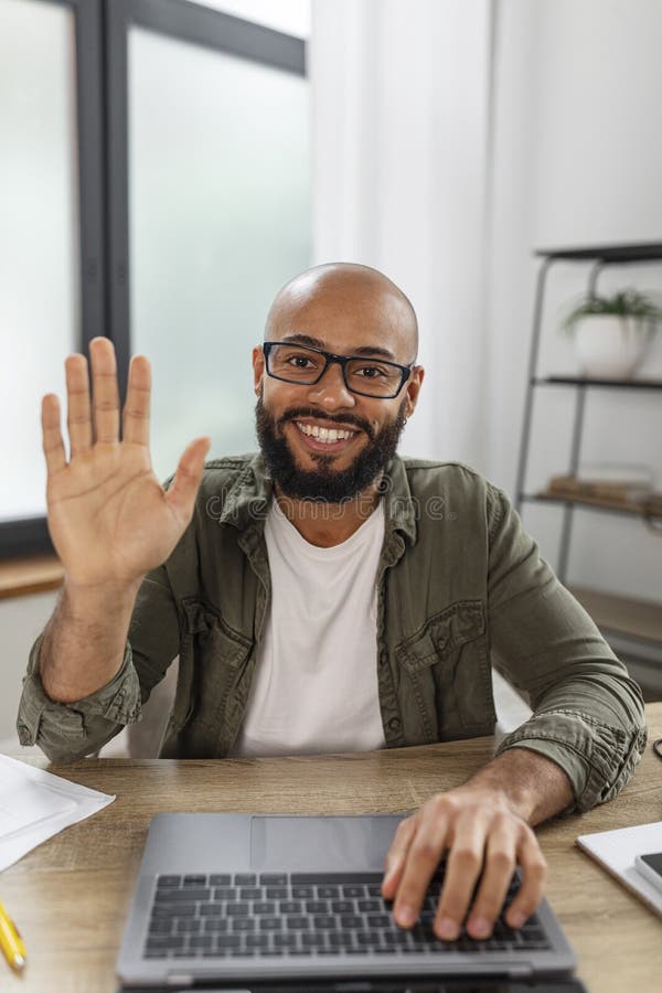 Greeting Concept. Portrait of Happy Freelancer Man Waving Hello at ...