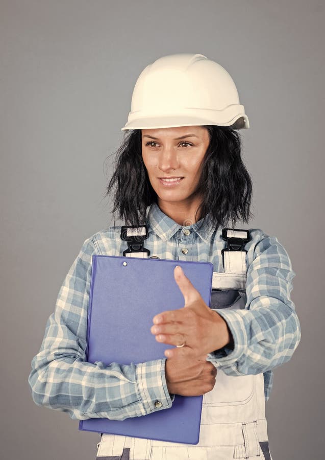 Greeting or Welcome. Girl in Workshop Uniform. Engineering. Architect ...