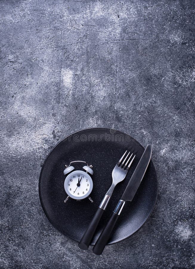 Grey Alarm Clock in Empty Plate. Stock Photo - Image of classic, knife ... Grey Alarm Clock in Empty Plate. Stock Photo - Image of classic, knife ...