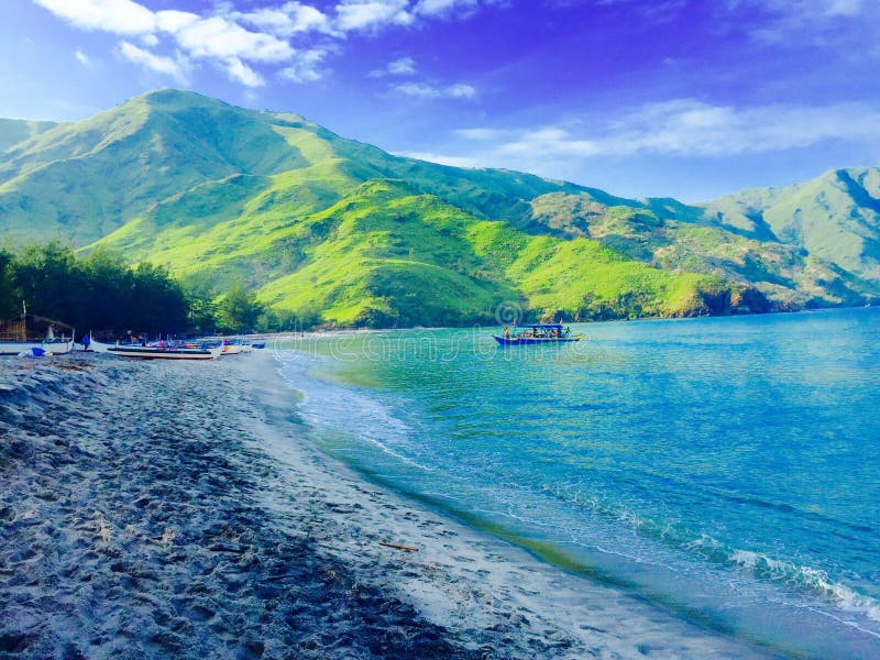 Grey beach and blue sea stock photo. Image of holiday - 235308880