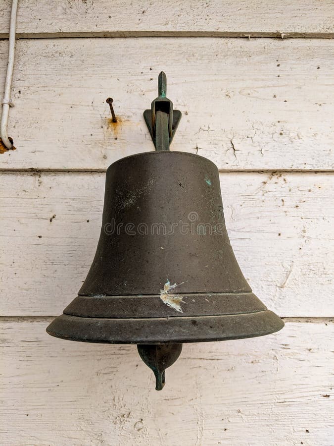 Grey Bell Against a Wooden Old Wall at the Seaside Stock Photo - Image ...