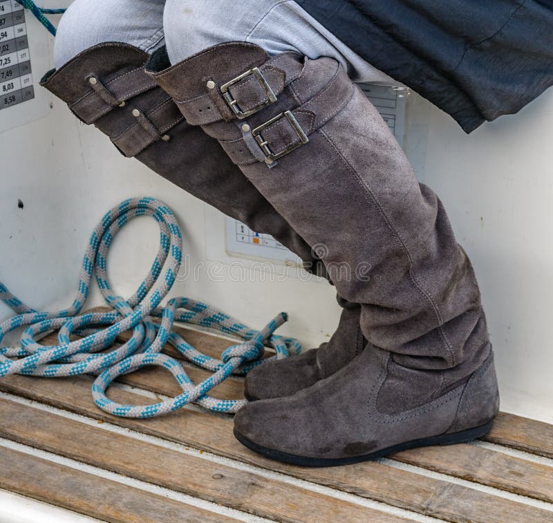Grey boots on a sailboat stock image. Image of boots - 119390081