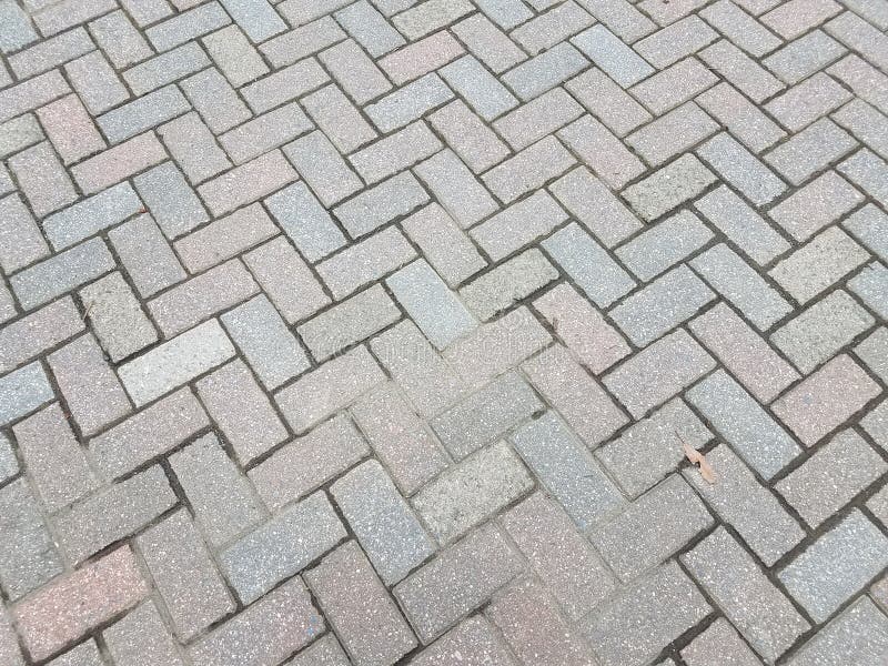 Grey bricks on the ground stock image. Image of tessellation - 121663927