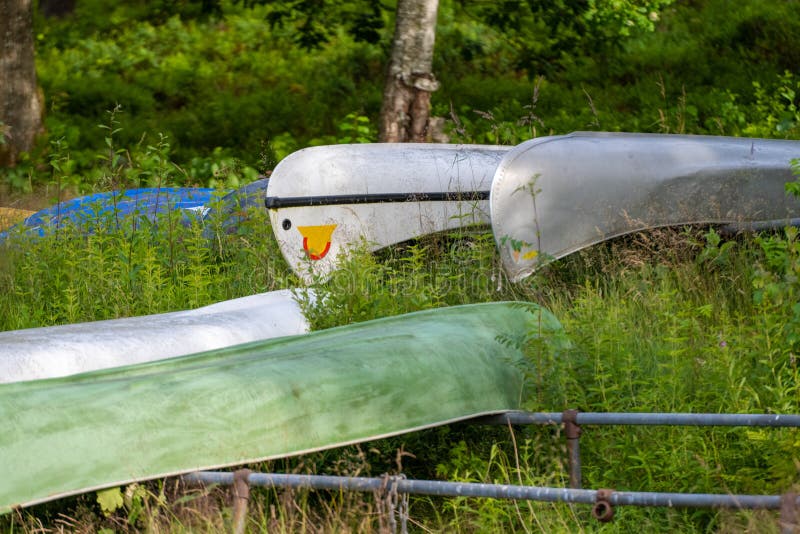 Grey Canoes in Storage Near a Lake.. Stock Photo - Image of scenic ...