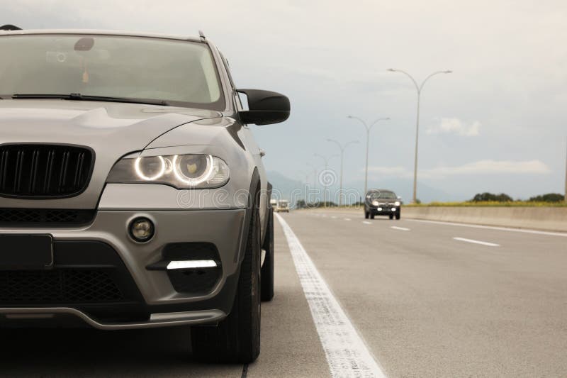 Grey Modern Car Parked on Asphalt Road Stock Image - Image of roadway ...