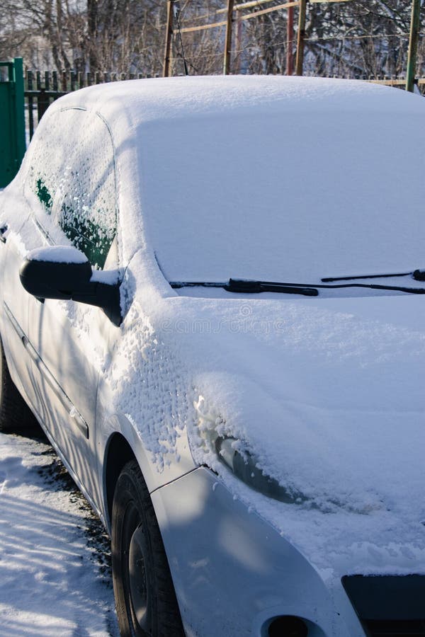 A Grey Car in the Snow. Close-up. Stock Photo - Image of parking ...