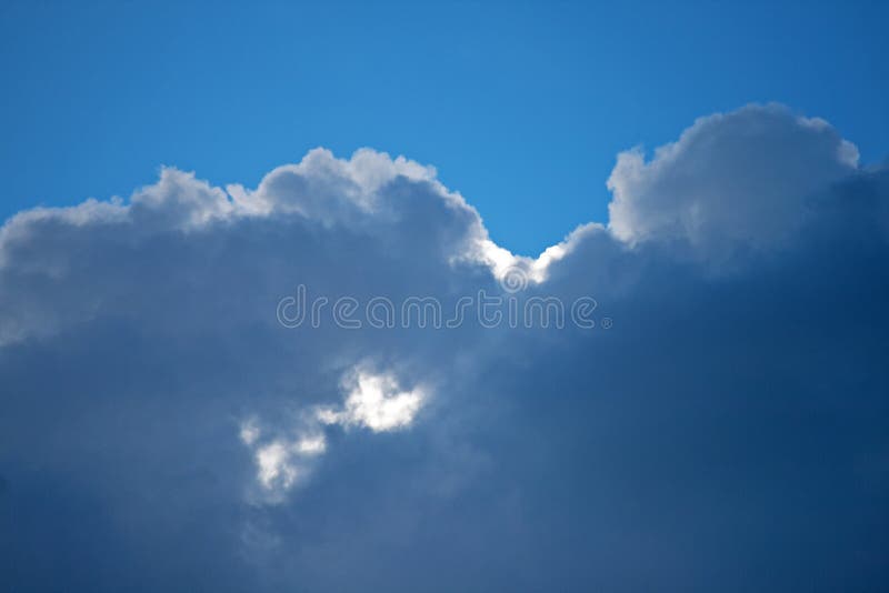 GREY CLOUD with HIGHLIGHTS AGAINST BLUE SKY Stock Image - Image of grey ...
