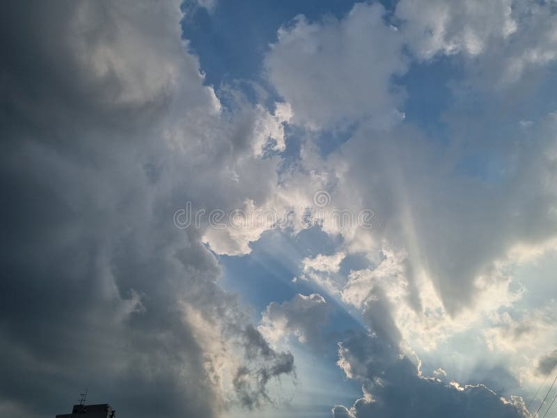 Grey cloud with sun ray stock photo. Image of daytime - 252392024