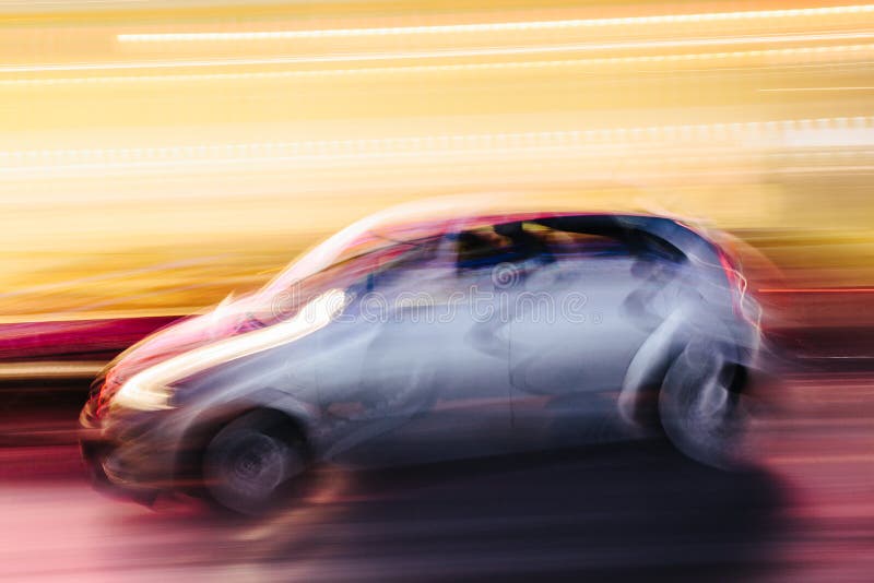 Grey Compact Car in a Blurred City Scene Stock Photo - Image of traffic ...