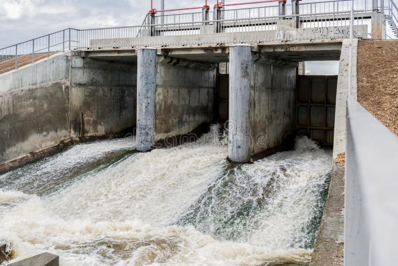 Concrete Dam on River with Flow of Foaming Water. Stock Image - Image ...