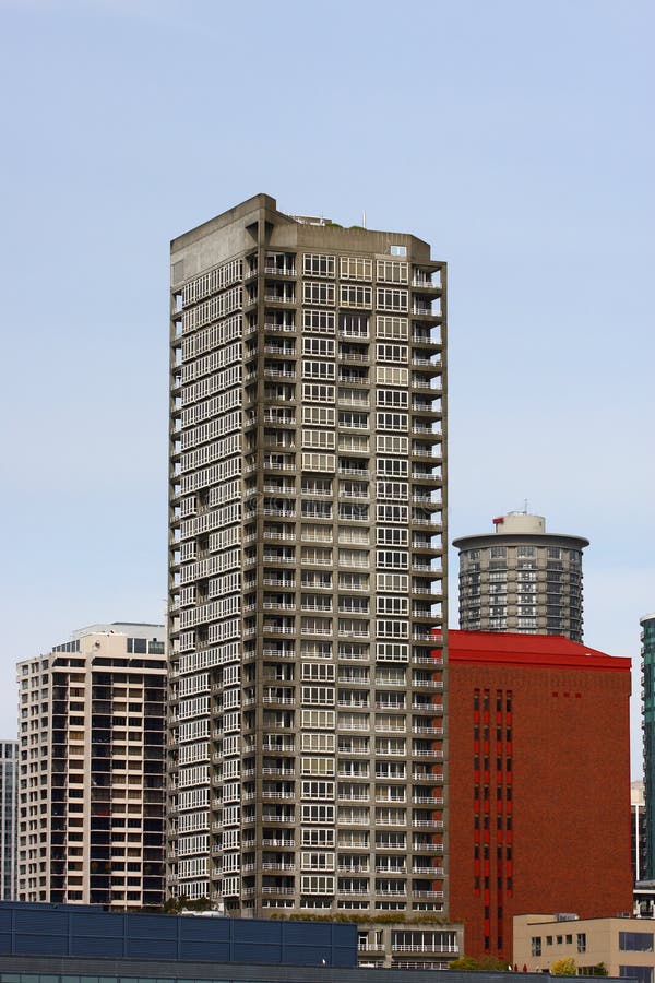 Grey Condo Tower by Red Brick Stock Photo - Image of seattle ...