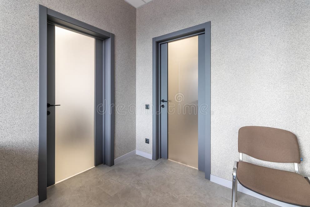 Grey Door with Glass Insert in Office Building Stock Image - Image of ...