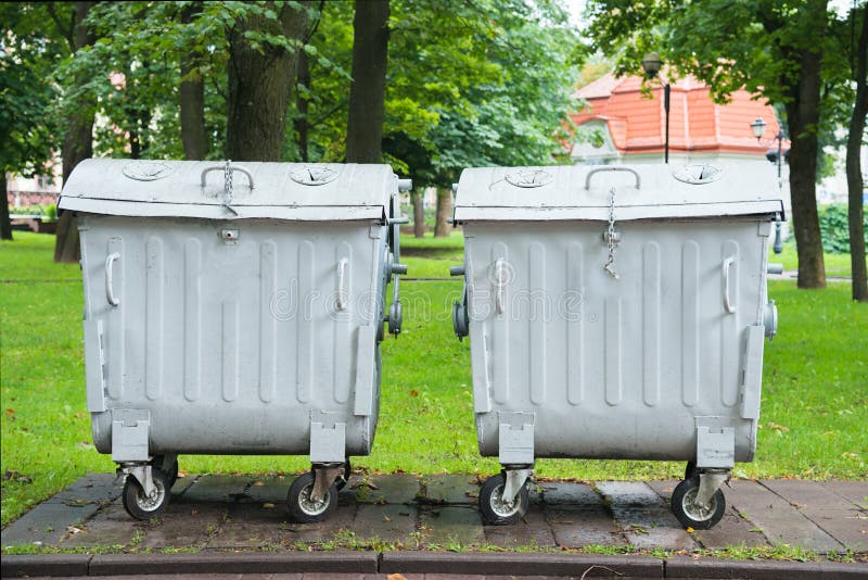 Garbage Containers In The Park Stock Photo - Image of blue, plastic ...