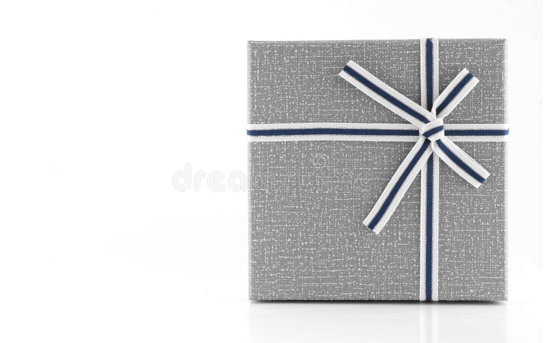 Grey Gift Box with Ribbon on Green Grass with Sun Light in the Morning ...