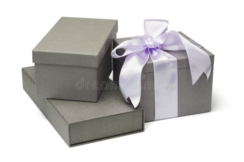 Grey Gift Box with Ribbon on Green Grass with Sun Light in the Morning ...