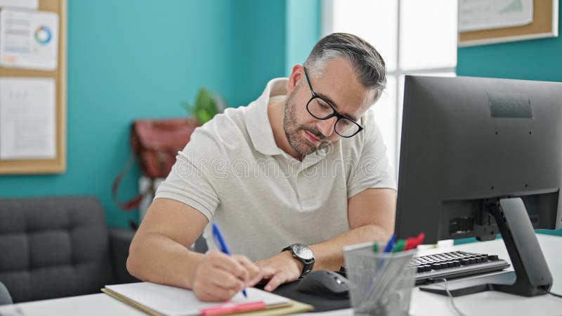 Grey-haired Man Business Worker Using Computer Writing on Document at ...