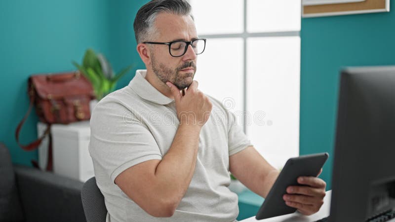Grey-haired Man Business Worker Using Touchpad Thinking at the Office ...