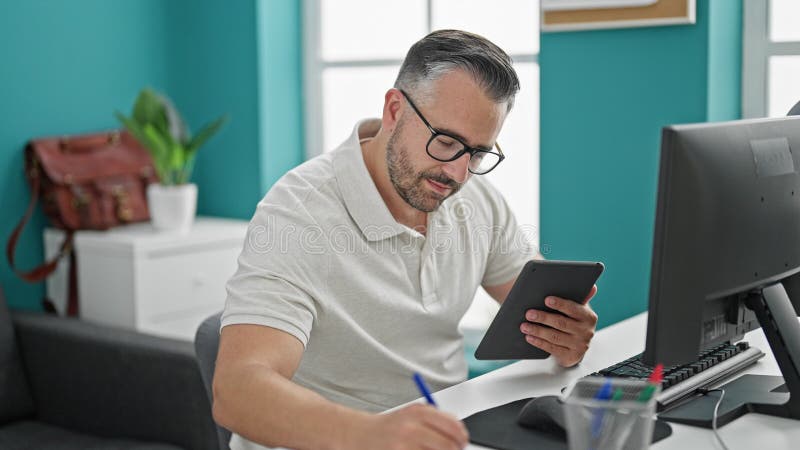 Grey-haired Man Business Worker Using Touchpad Writing on Document at ...