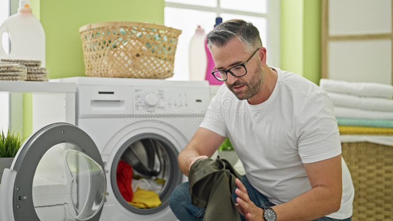 Grey-haired Man Washing Clothes at Laundry Room Stock Video - Video of ...