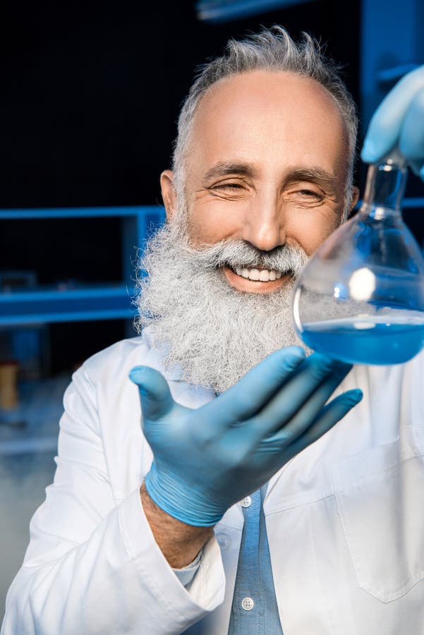 Grey Haired Scientist in Lab Coat Holding Flask with Reagent at ...