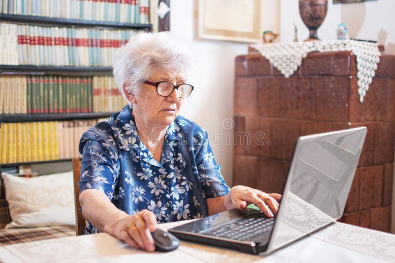 Grey-haired Senior Woman Using Laptop at Home. Stock Photo - Image of ...