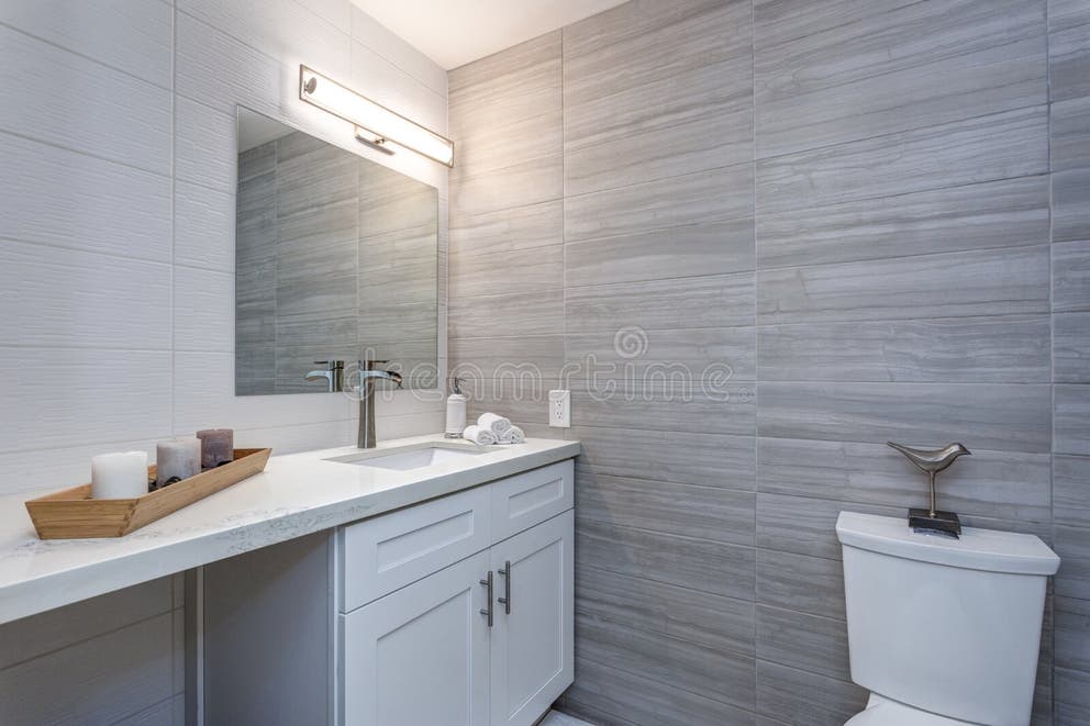 Grey Interior of a New Bathroom in Apartment Complex Stock Photo ...