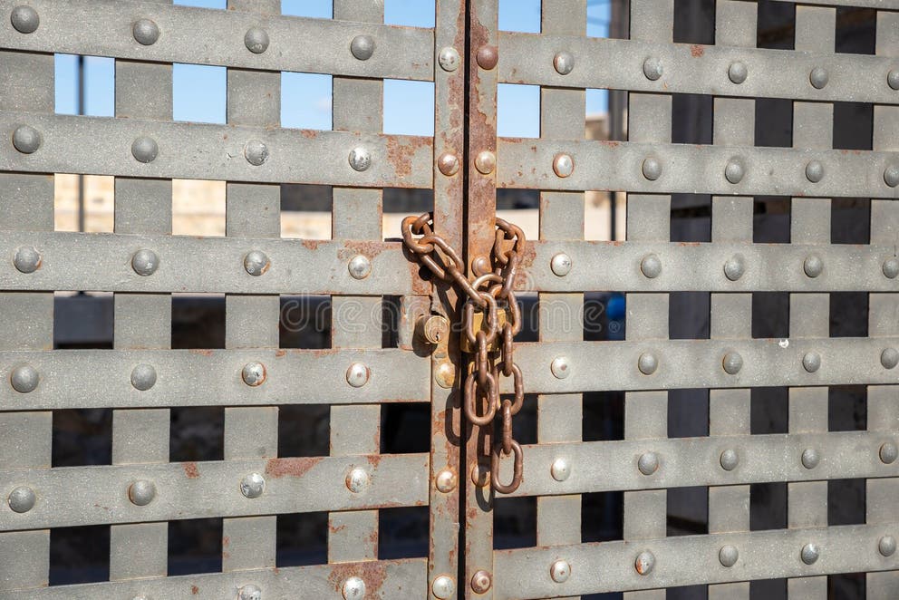 Grey Iron Gate Closed with Rusty Chain and Padlock Stock Image - Image ...