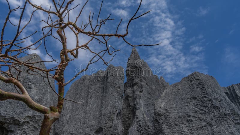 Grey Karst Limestone Cliffs Against a Blue Sky Background. Stock Photo ...