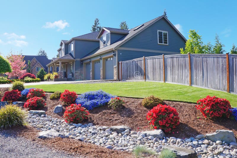 House Spring Backyard with Rock Wall and Kids Playground. Stock Photo ...