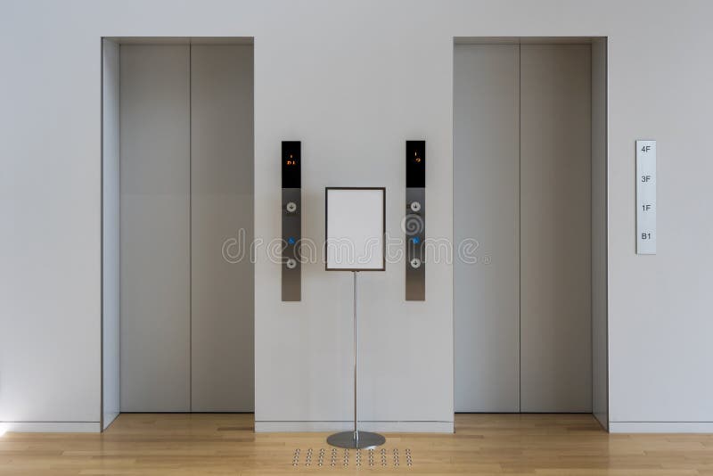 Lobby with grey armchairs stock photo. Image of business - 173479458