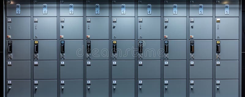 Grey Lockers with Secure Locks and Numbered Doors Stock Image - Image ...