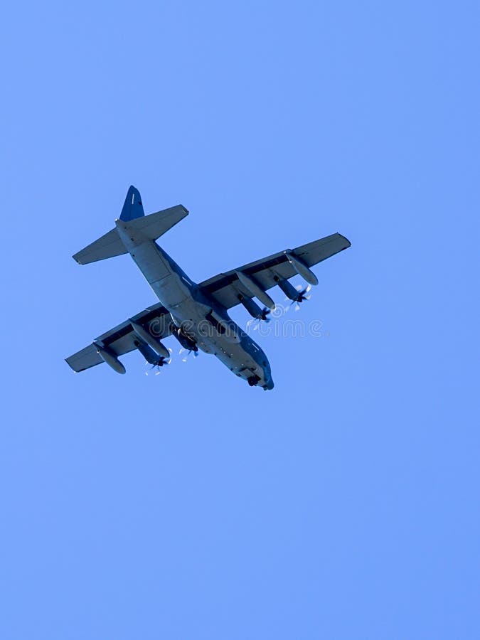 Grey Military Transport Plane Fly on Blue Sky Background Stock Image ...