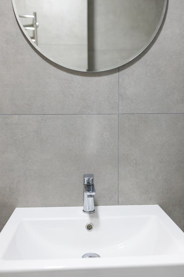 Grey Modern Bathroom Faucet and Sink with Mirror Reflection Stock Image ...