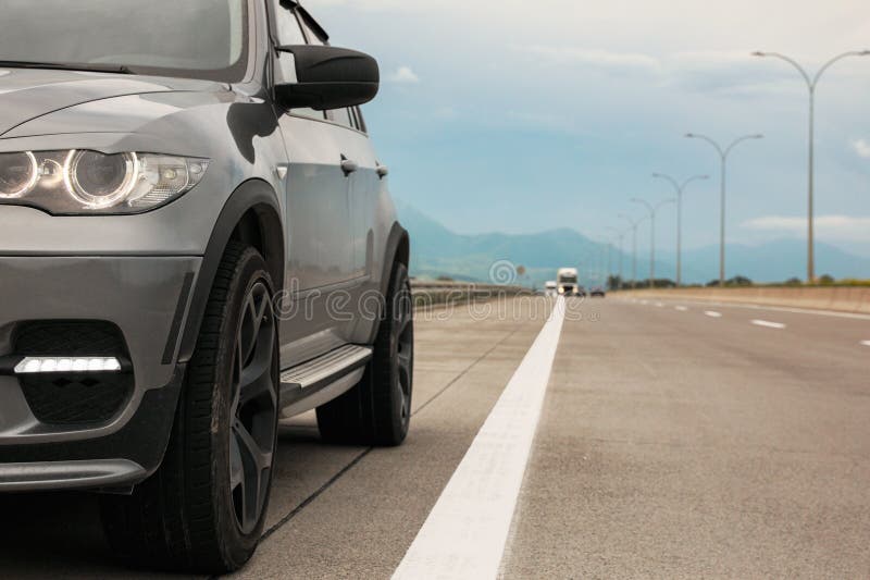 Grey Modern Car Parked on Asphalt Road Stock Image - Image of cloudy ...